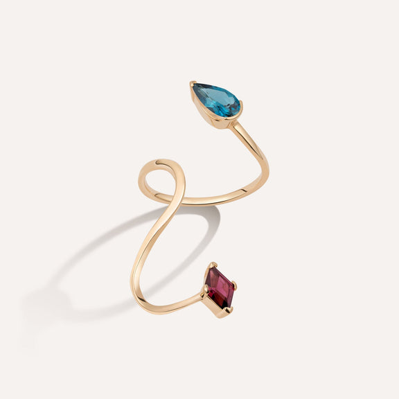 LÚDERE gold open band ring with London blue topaz pear and rhodolite ...